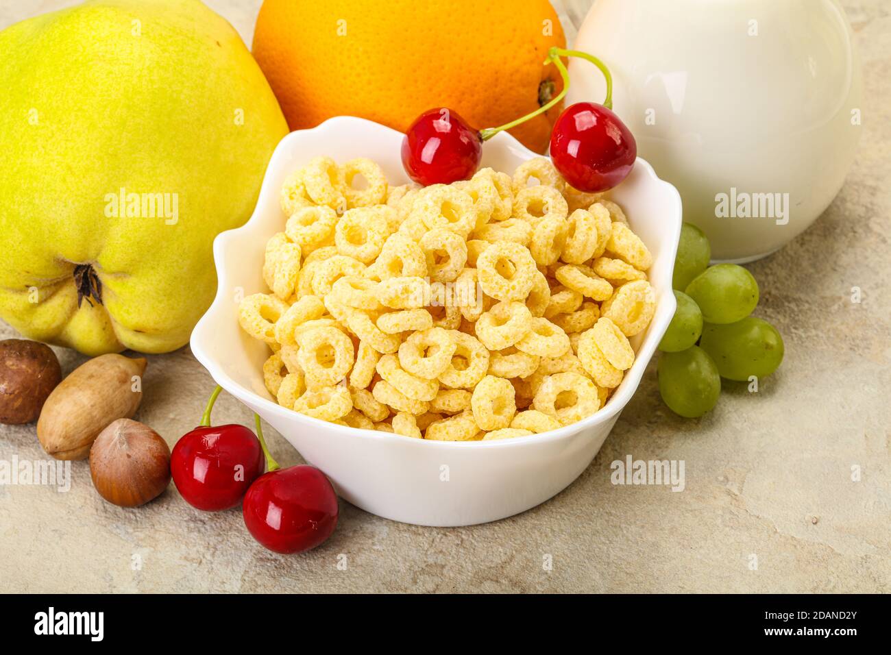 Breakfast with corn rings, fruits and milk Stock Photo - Alamy