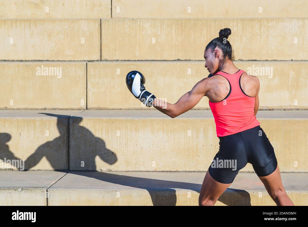 young african american female boxer wearing pink and black sports ...