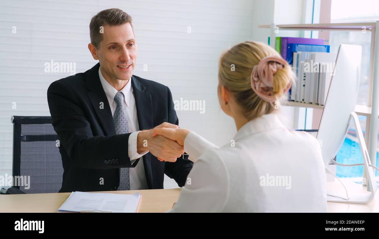 Job interview man woman young hand hi-res stock photography and images ...