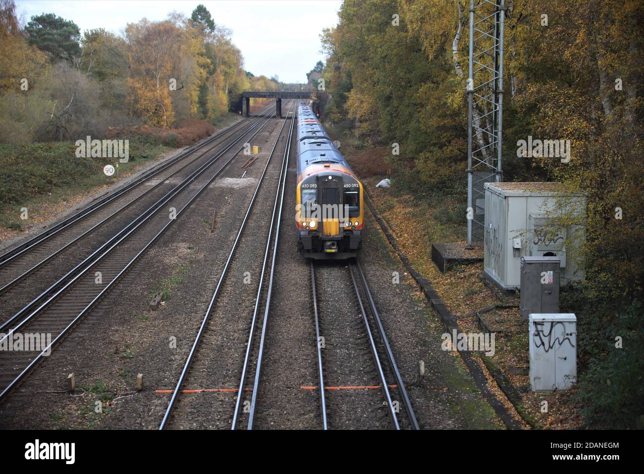 railway train heading down tracks Stock Photo - Alamy