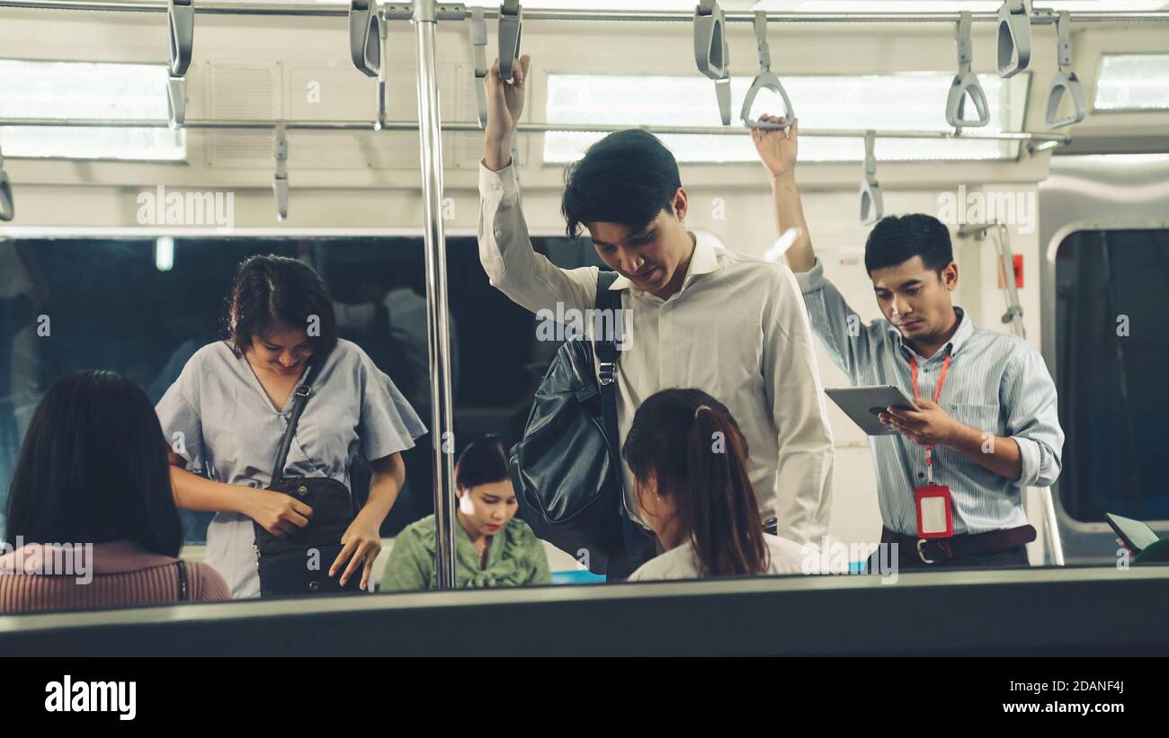 Many people crowded into a full subway hi-res stock photography and ...