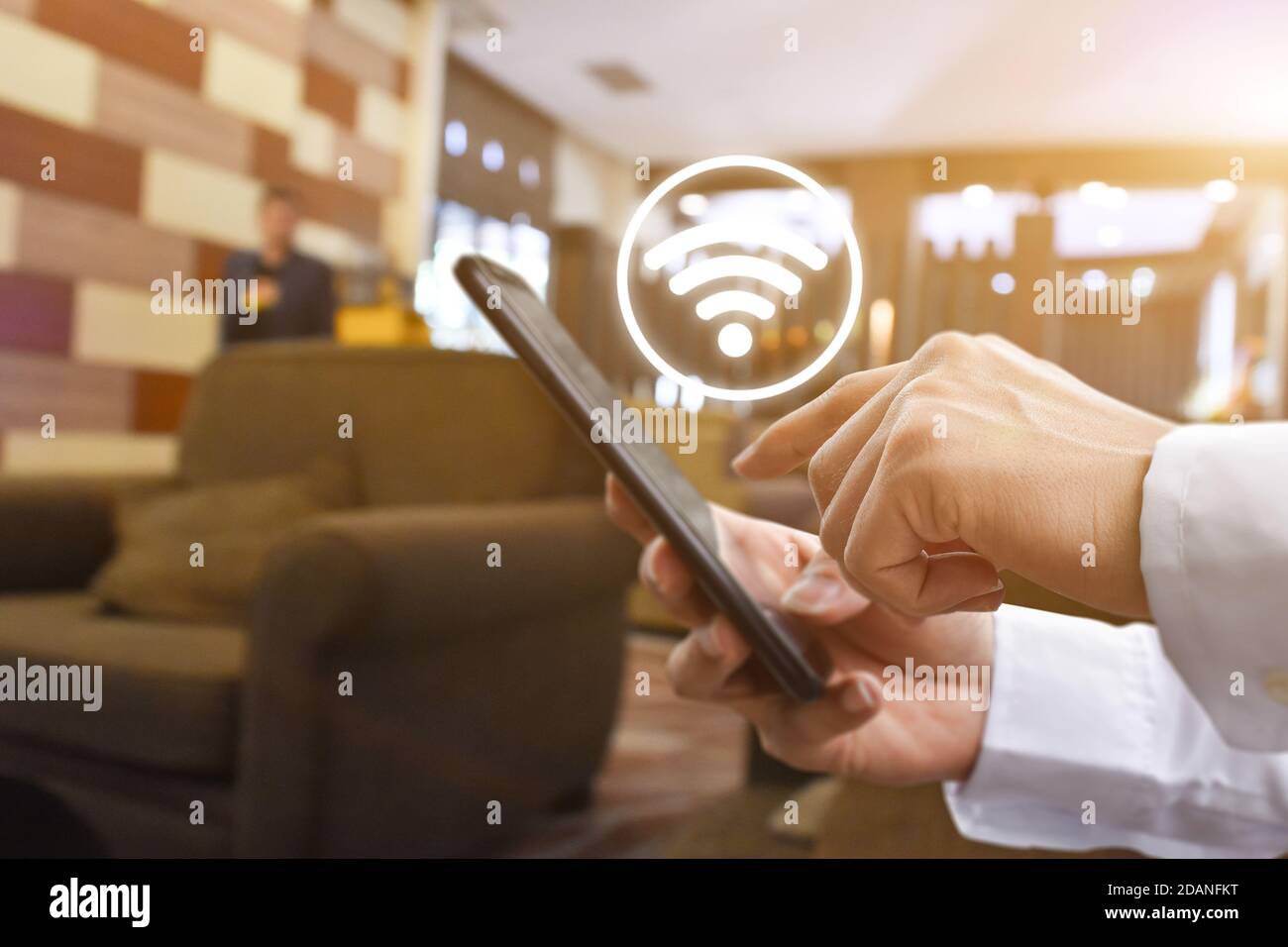 Hand using mobile smartphone with wifi icon. Idea for business ...