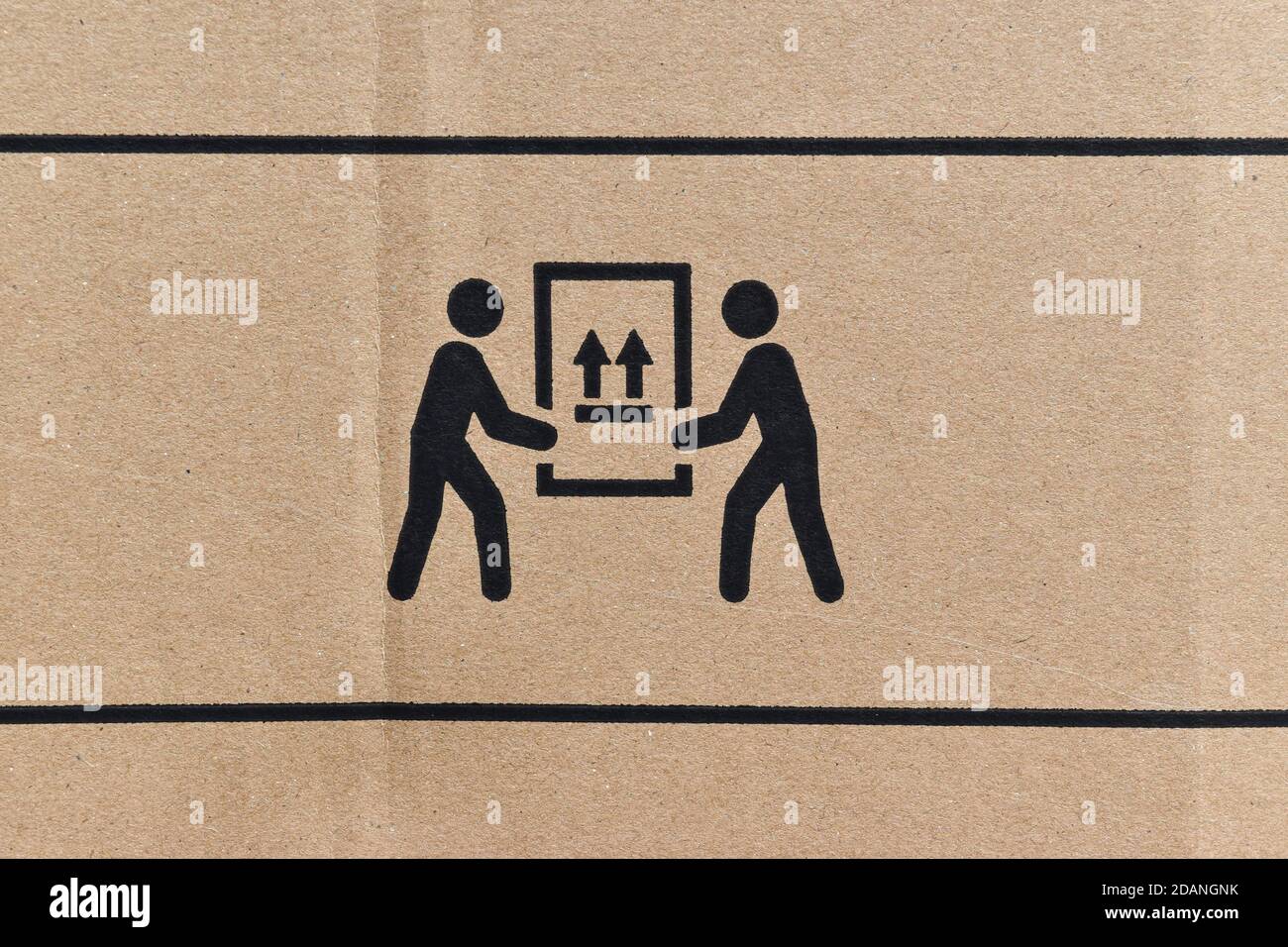 Close Up of cardboard box with packaging symbols as background. Package ...