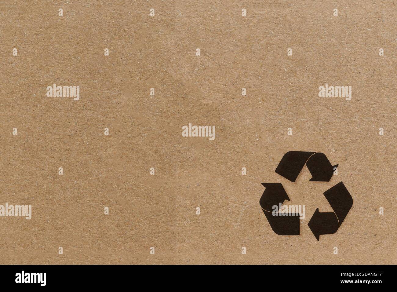 Black recycle symbol on cardboard background Stock Photo - Alamy