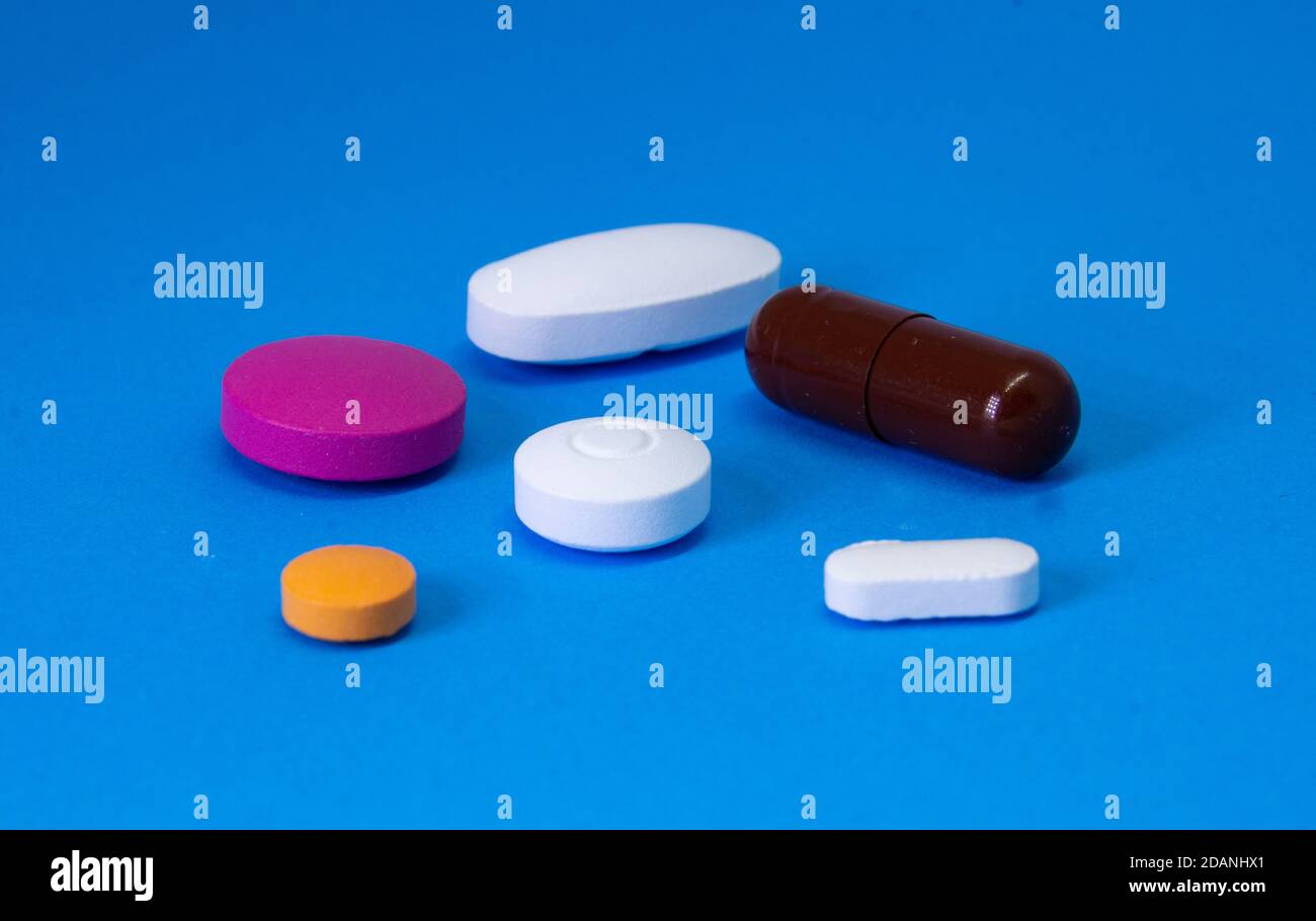 Pharmacy and Hospital theme. mix of pills and capsules with ...