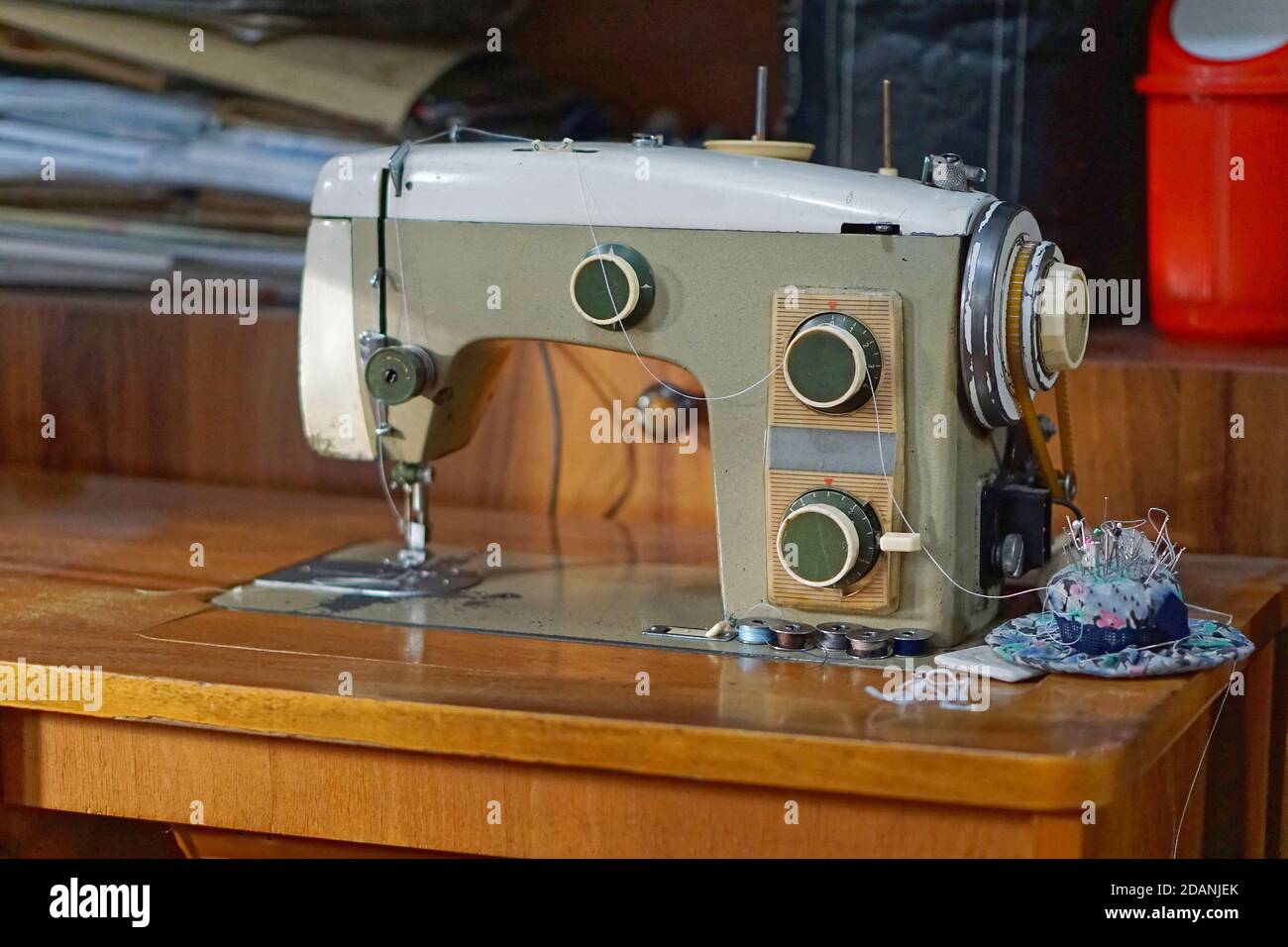 Vintage style sewing machine build in work table Stock Photo - Alamy
