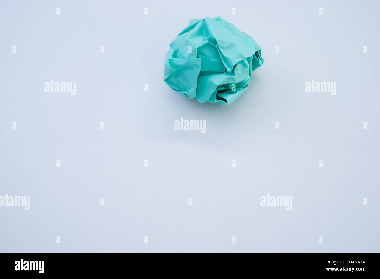 Closeup of teal colored paper on white background Stock Photo - Alamy
