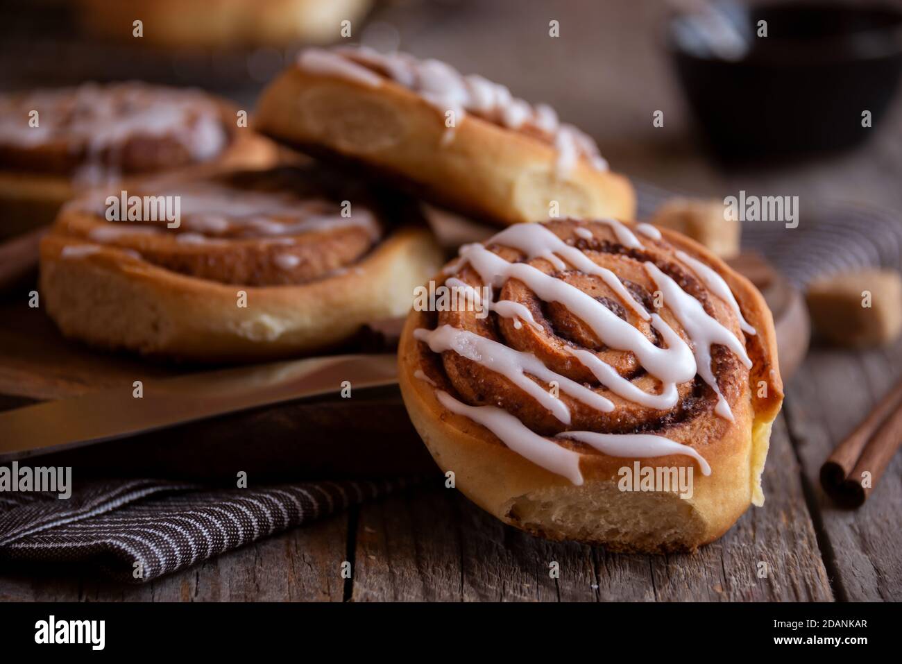 Fresh baked cinnamon buns with frosting Stock Photo - Alamy