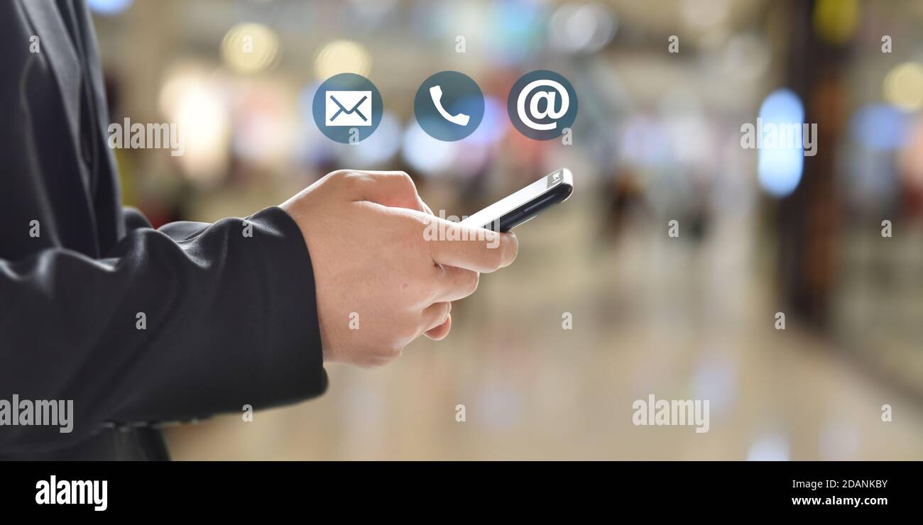 Businessman using mobile smartphone. Concept of Contact Us, customer ...