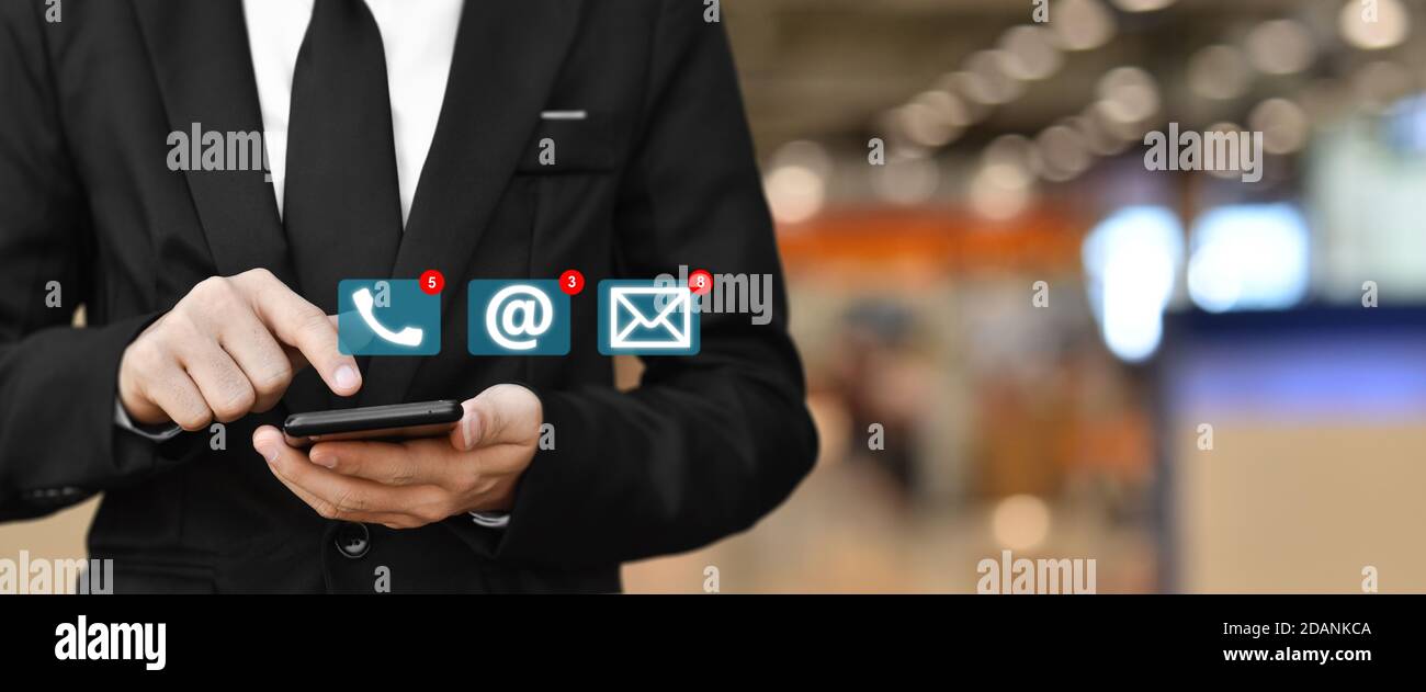 CONTACT US, Businessman hand holding mobile phone with ( address, phone ...