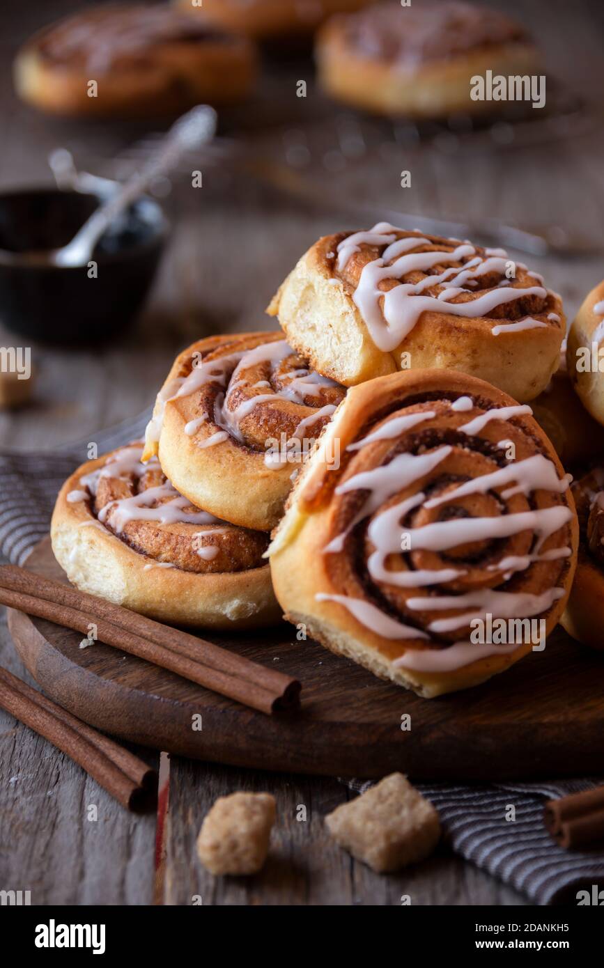 Fresh baked cinnamon buns with frosting Stock Photo - Alamy