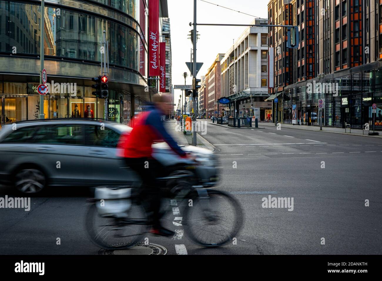 bicycle and car driving on the street Stock Photo - Alamy