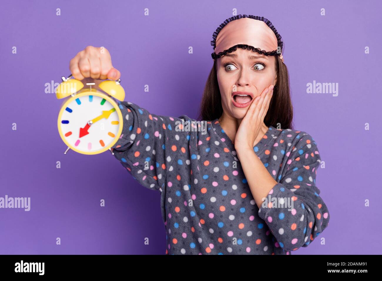 Omg unbelievable. Photo of shocked worried girl hold clock missed time ...