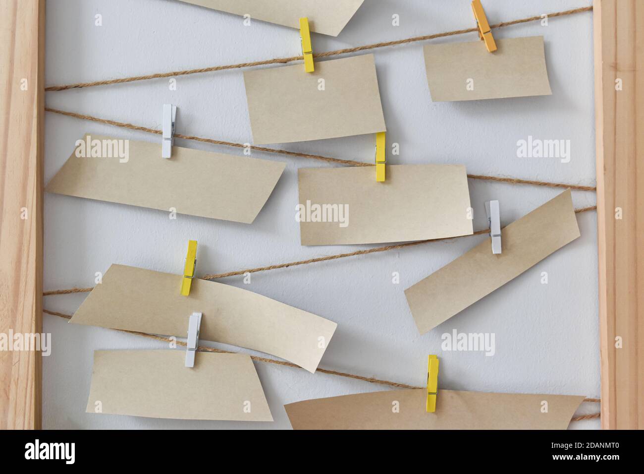 Blank notice card, brown paper and wood clip. Paper hang for text or ...