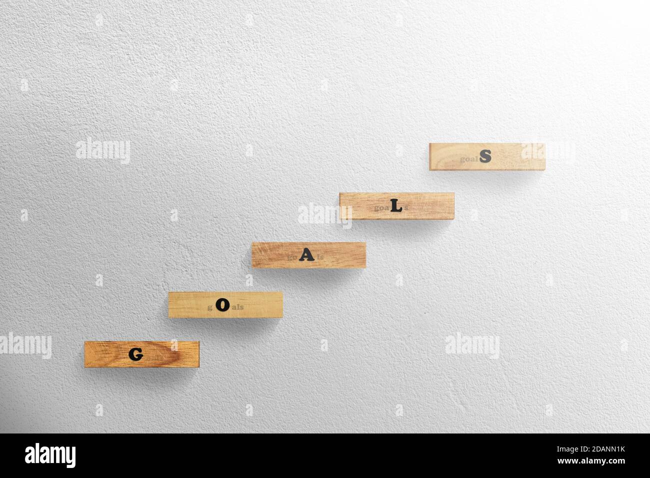 Wooden stair shape with the word GOALS. Increasing business concept ...
