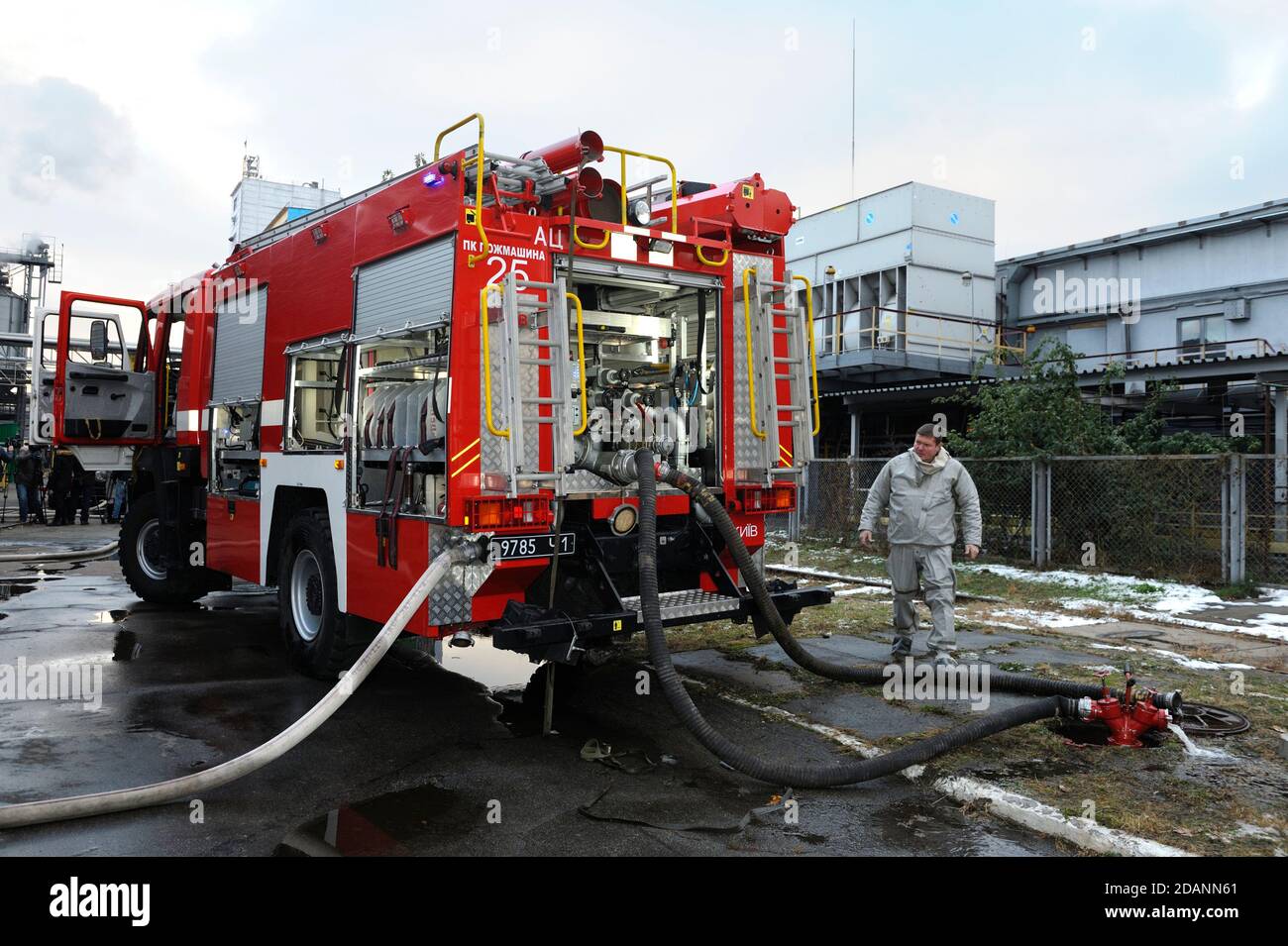 Rescuer team training chemical decontamination: fire truck parked ...