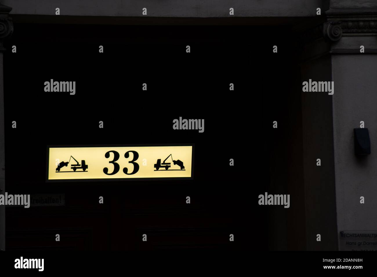 illuminated sign with the number 33 and cars Stock Photo - Alamy