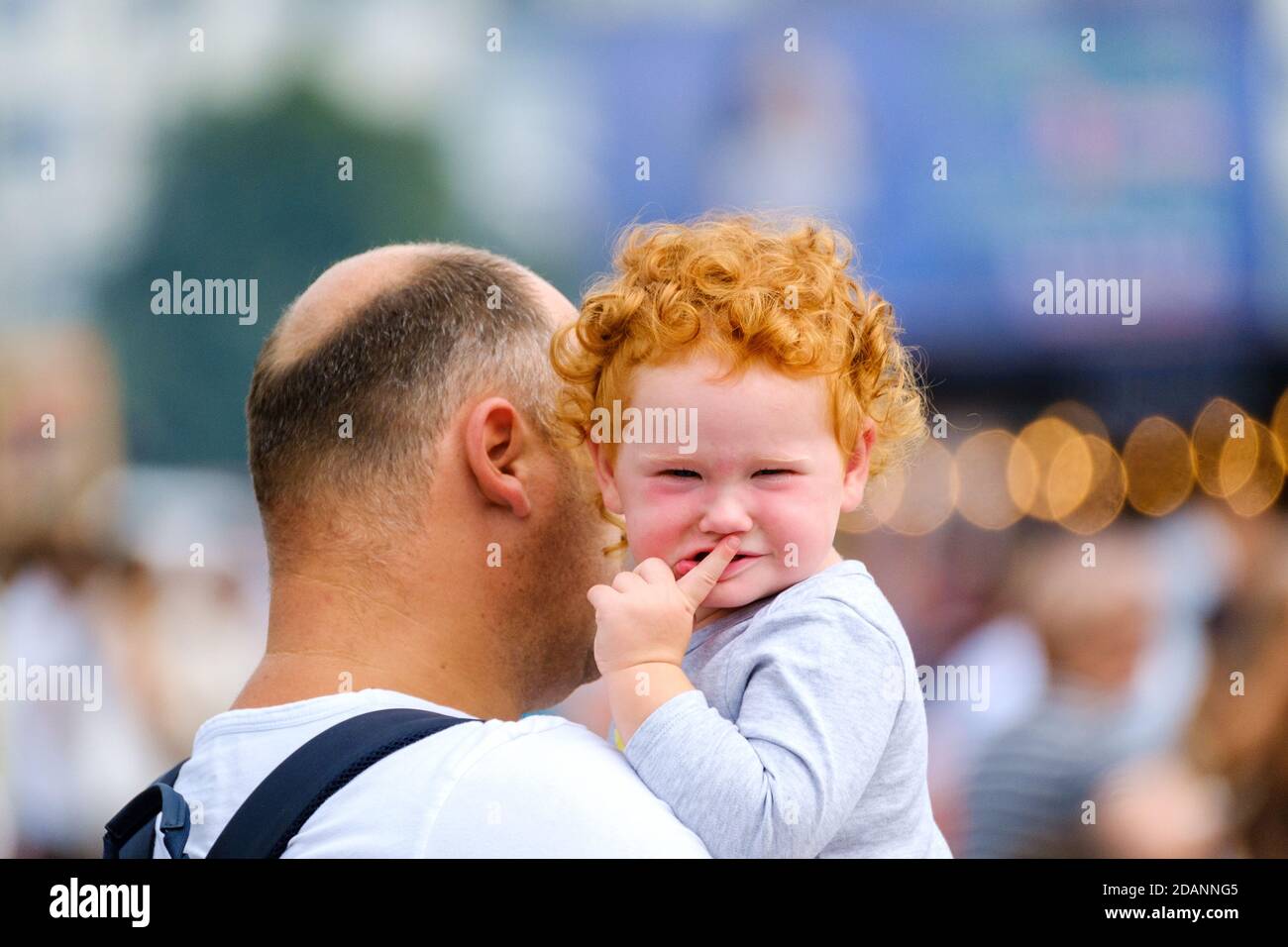 Middle aged father with crying baby Stock Photo - Alamy