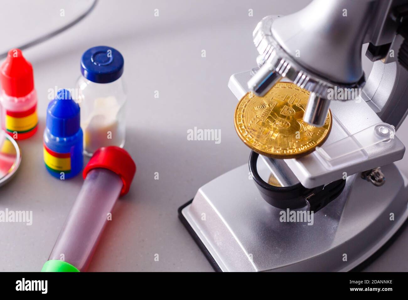 Coin crypto currency bitcoin lies on the microscope background theme of ...