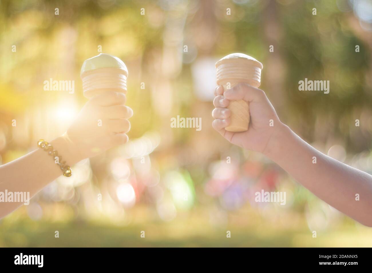 Hand holding soft ice cream outdoor with natural light hi-res stock ...