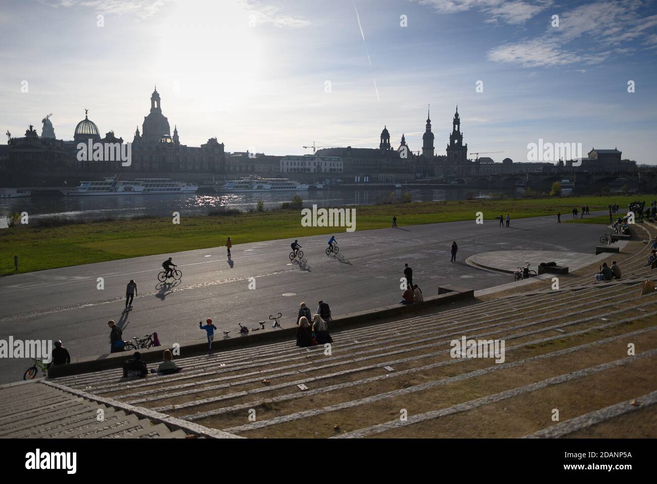 Dresden, Germany. 14th Nov, 2020. Some people are sitting on the steps ...