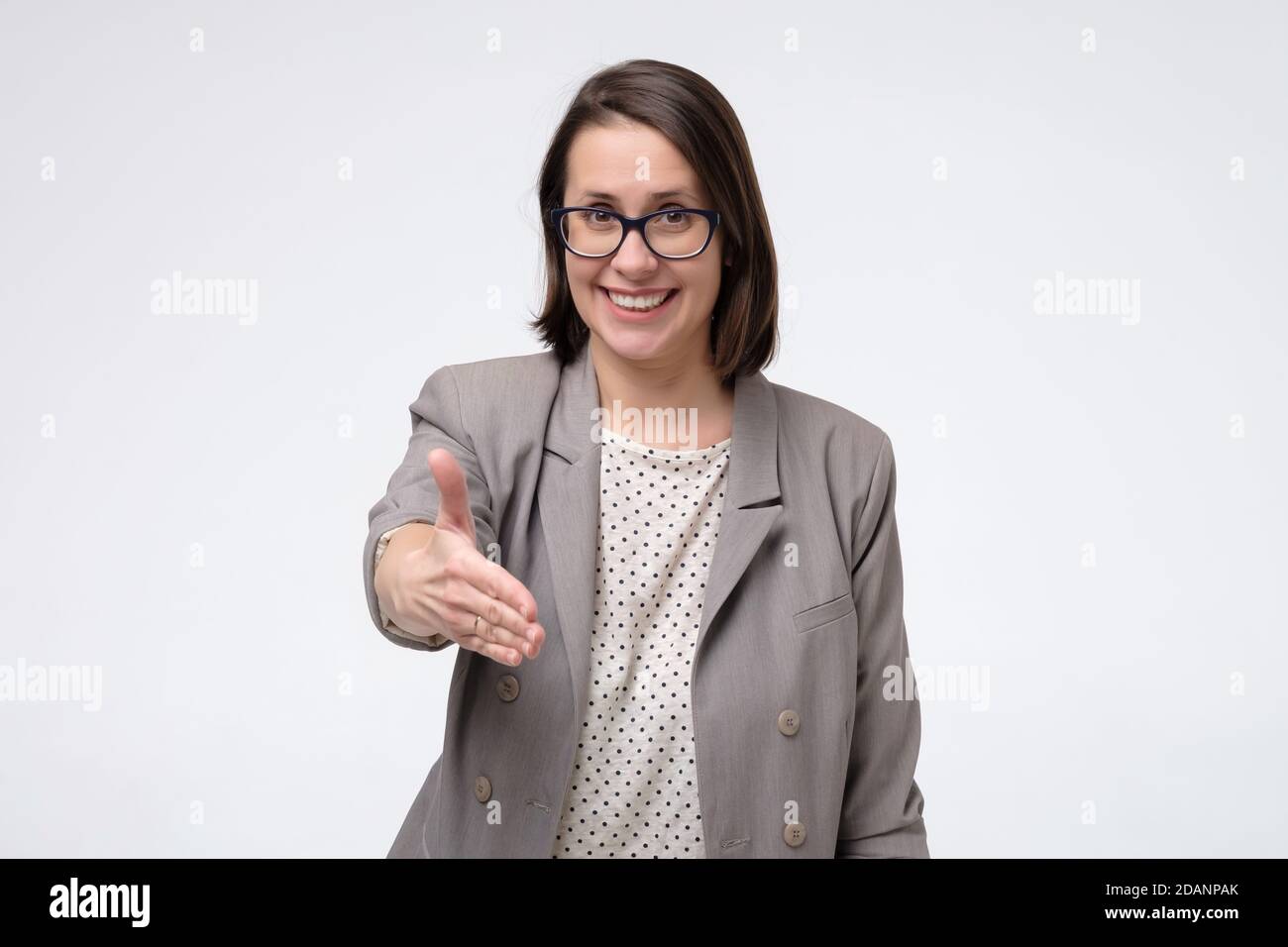 Hand reaching out suit hi-res stock photography and images - Alamy