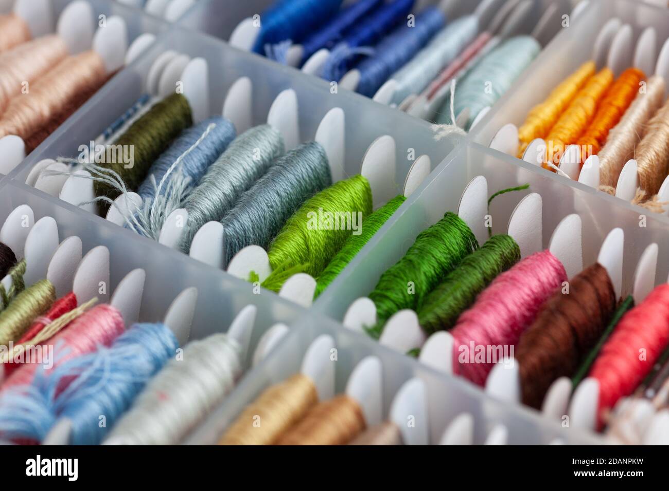 Embroidery cross-stitch thread cards in a sorting box. Close up Stock ...