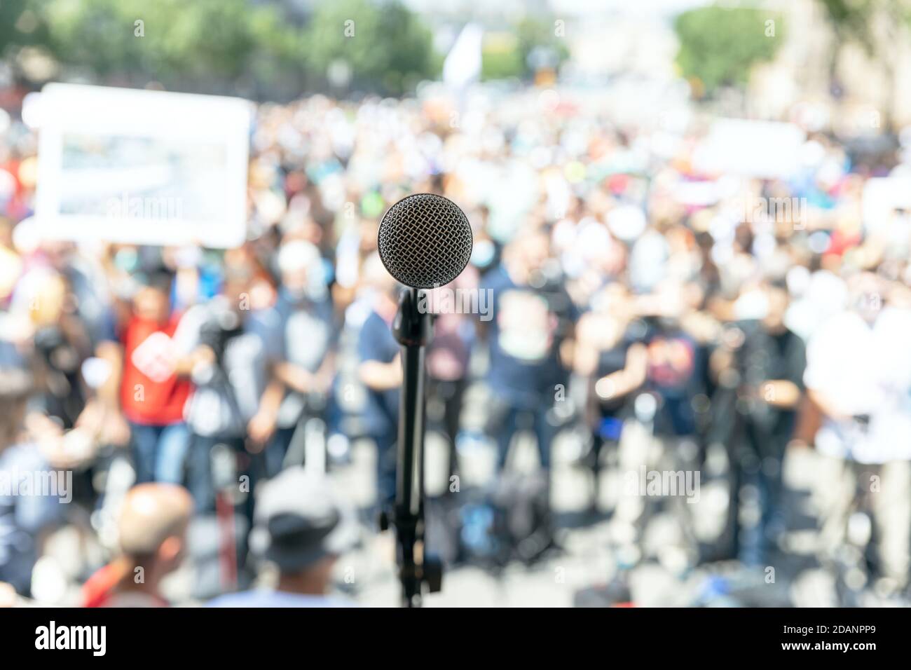 Public demonstration or political protest. Microphone in focus against ...