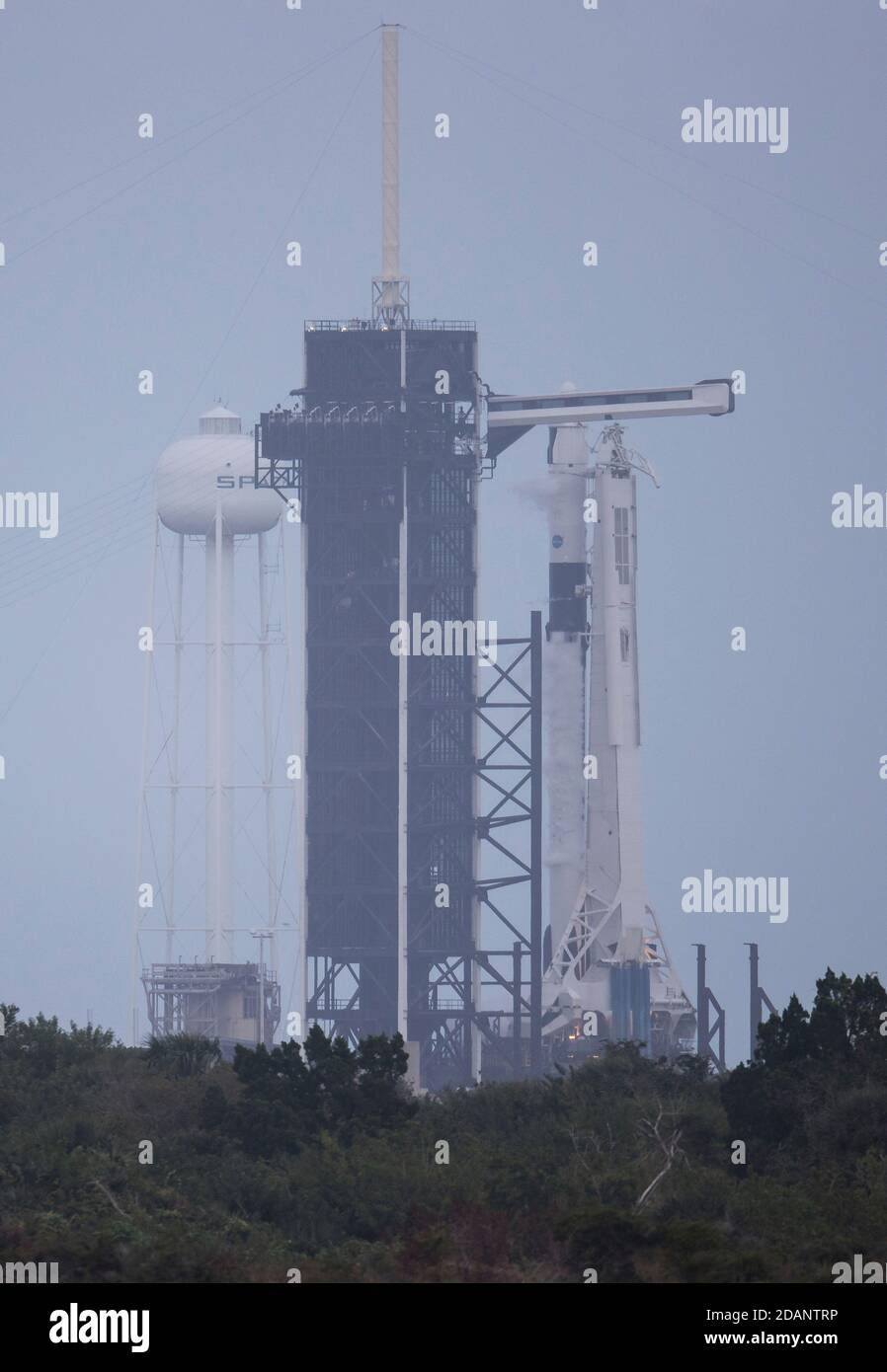 The Spacex Falcon 9 Rocket Carrying The Crew Dragon Spacecraft Onboard