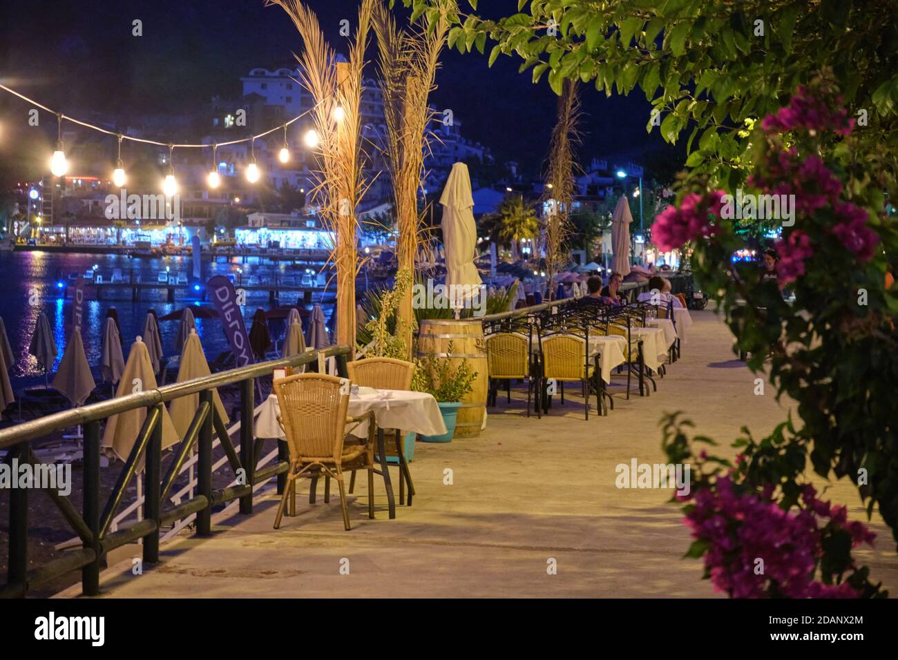 Cafes at the promenade of Turunc at night, Turkey Stock Photo - Alamy