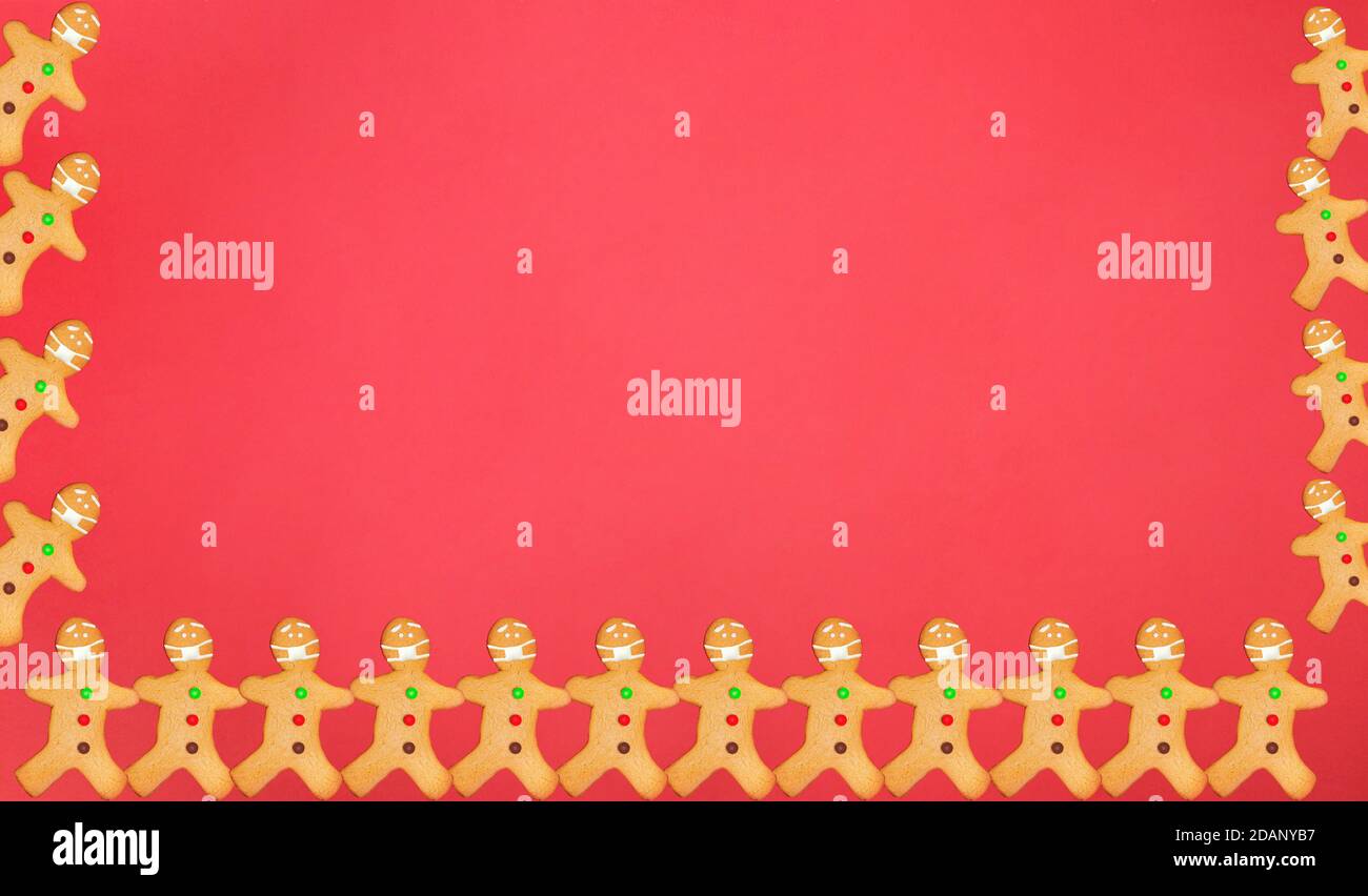 Red background with gingerbread men - Christmas background Stock Photo ...