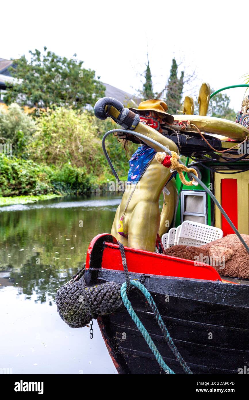 An unusual, decorated barge houseboat along the Grand Union Canal in ...