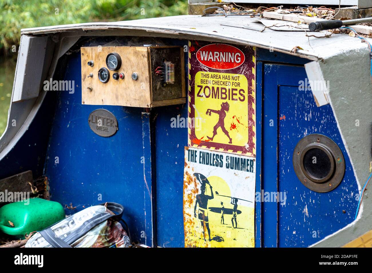 Barge decorated with unusual signs along the Grand Union Canal, Colne ...