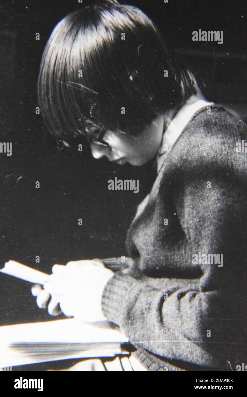 Fine 1970s vintage black and white photography of a young kid reading a ...