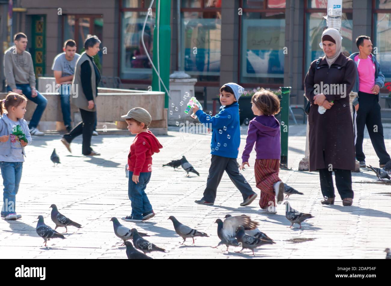 Timisoara, Romania - June 02, 2013: Kids playing with soap bubbles in ...