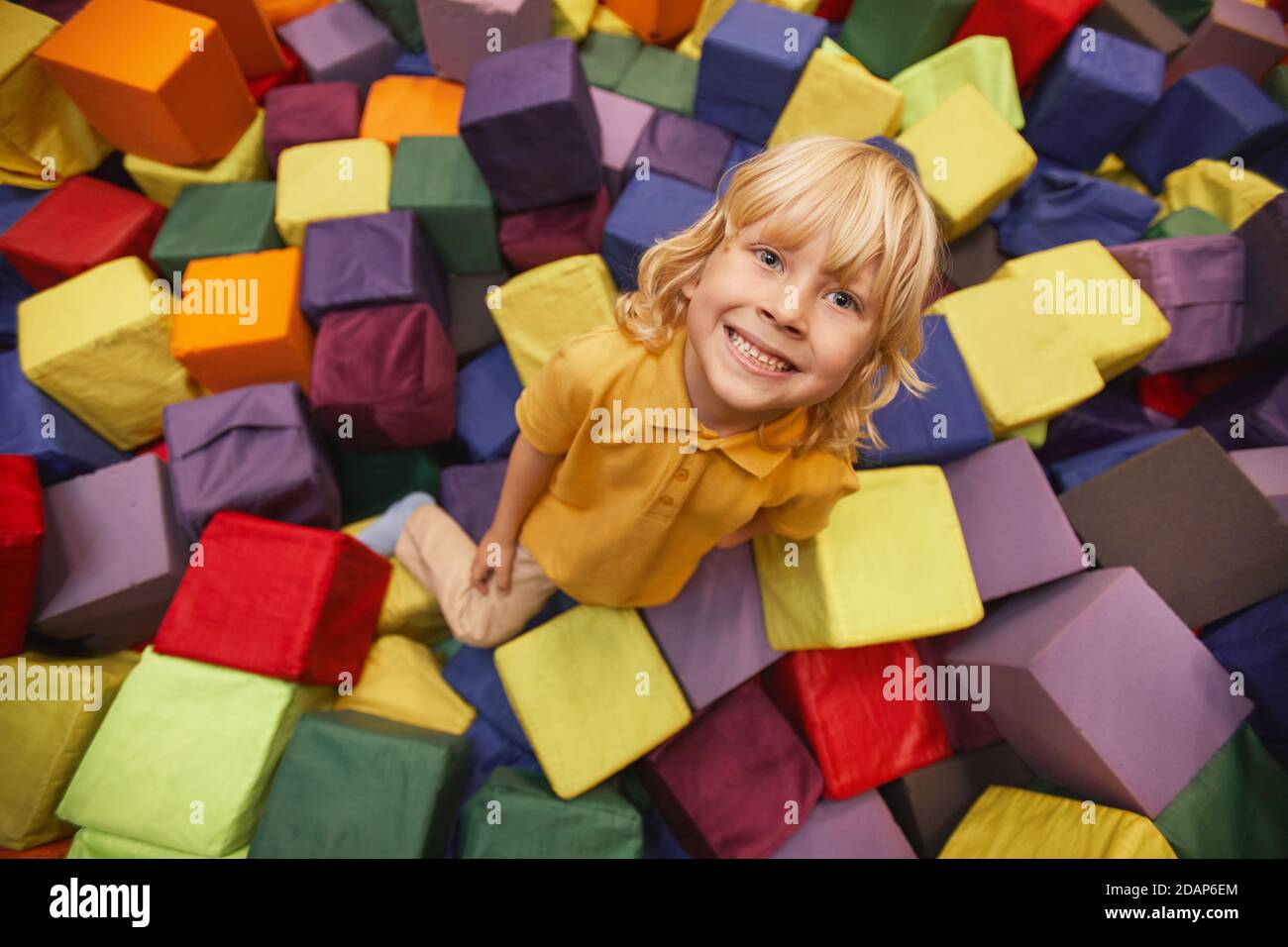 Happy children playing cubes hi-res stock photography and images - Alamy