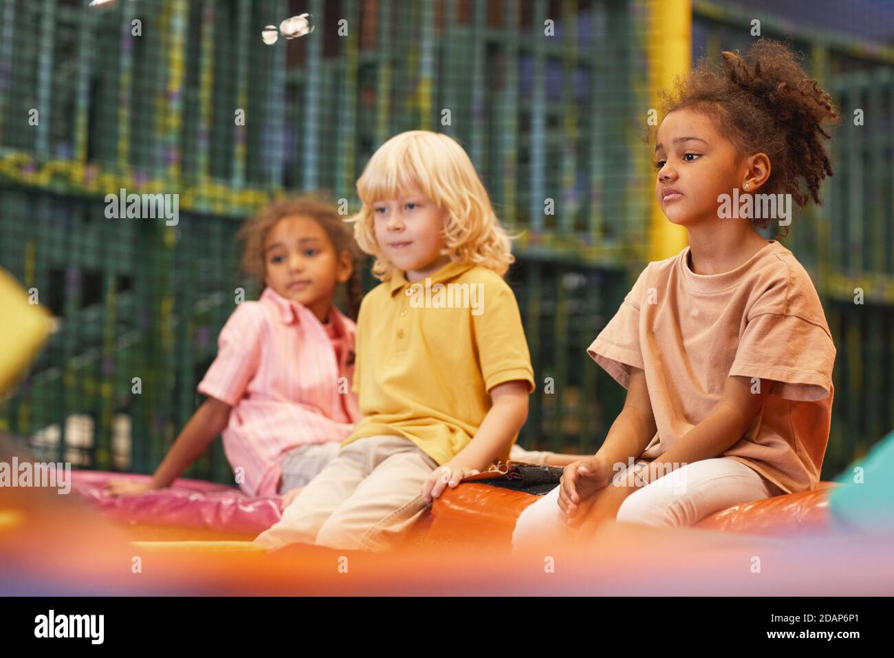 Group of friends playing together in games in amusement park Stock ...