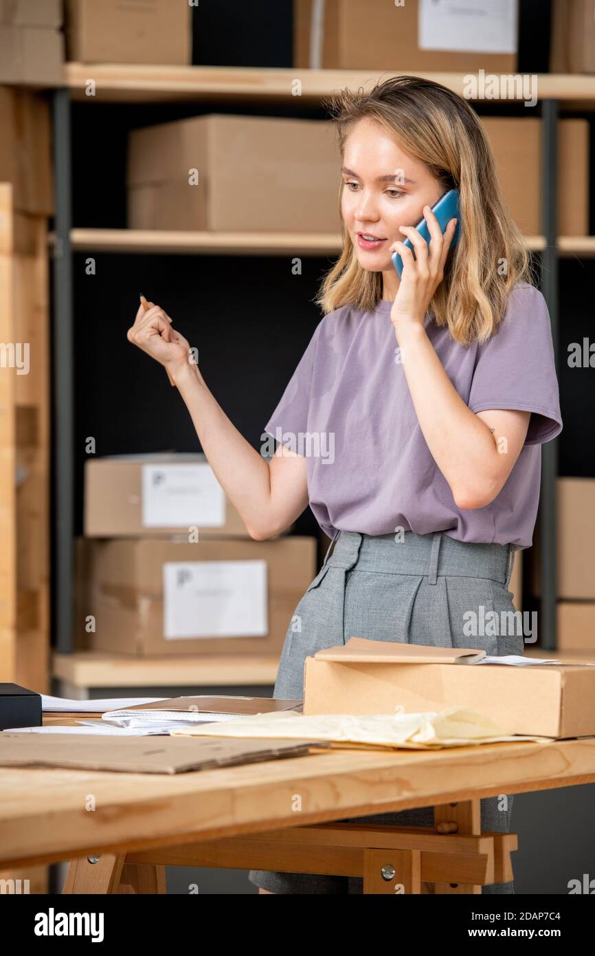 Professional women calling clients hi-res stock photography and images ...