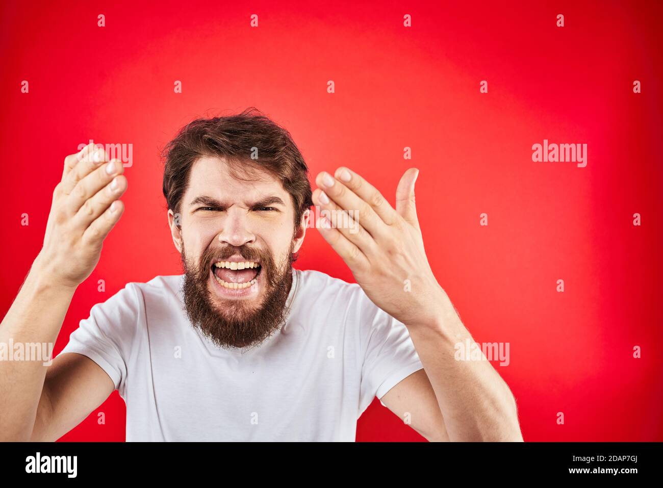 bearded man gesturing with hands white t-shirt emotions facial ...