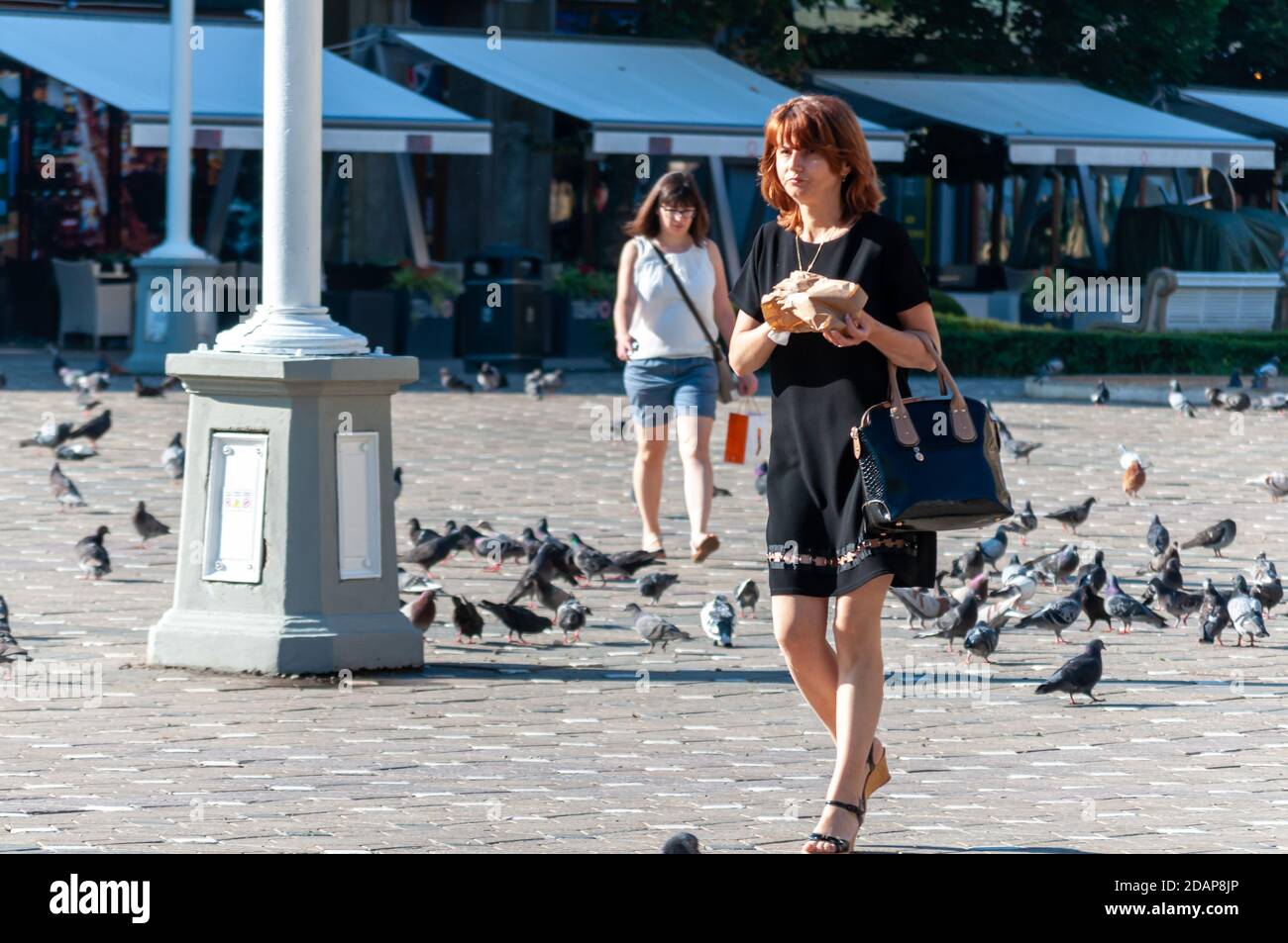 Timisoara, Romania - June 27, 2017: Woman walking on the street and ...
