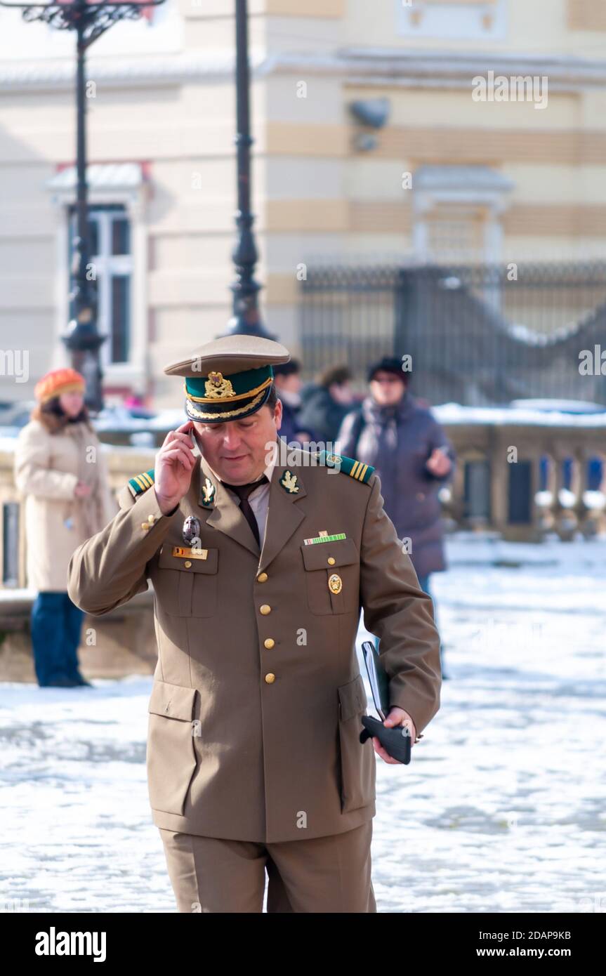 Timisoara, Romania - January 30, 2014: Man walking on the street ...
