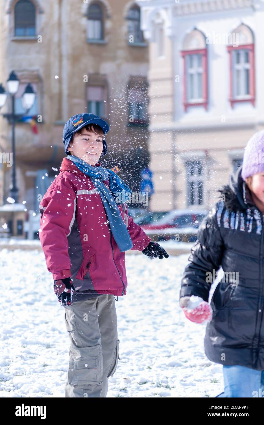 Timisoara, Romania - January 30, 2014: Kids playing with snow in the ...
