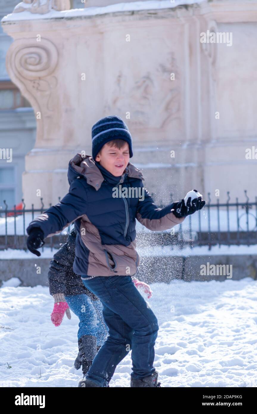 Timisoara, Romania - January 30, 2014: Kids playing with snow in the ...