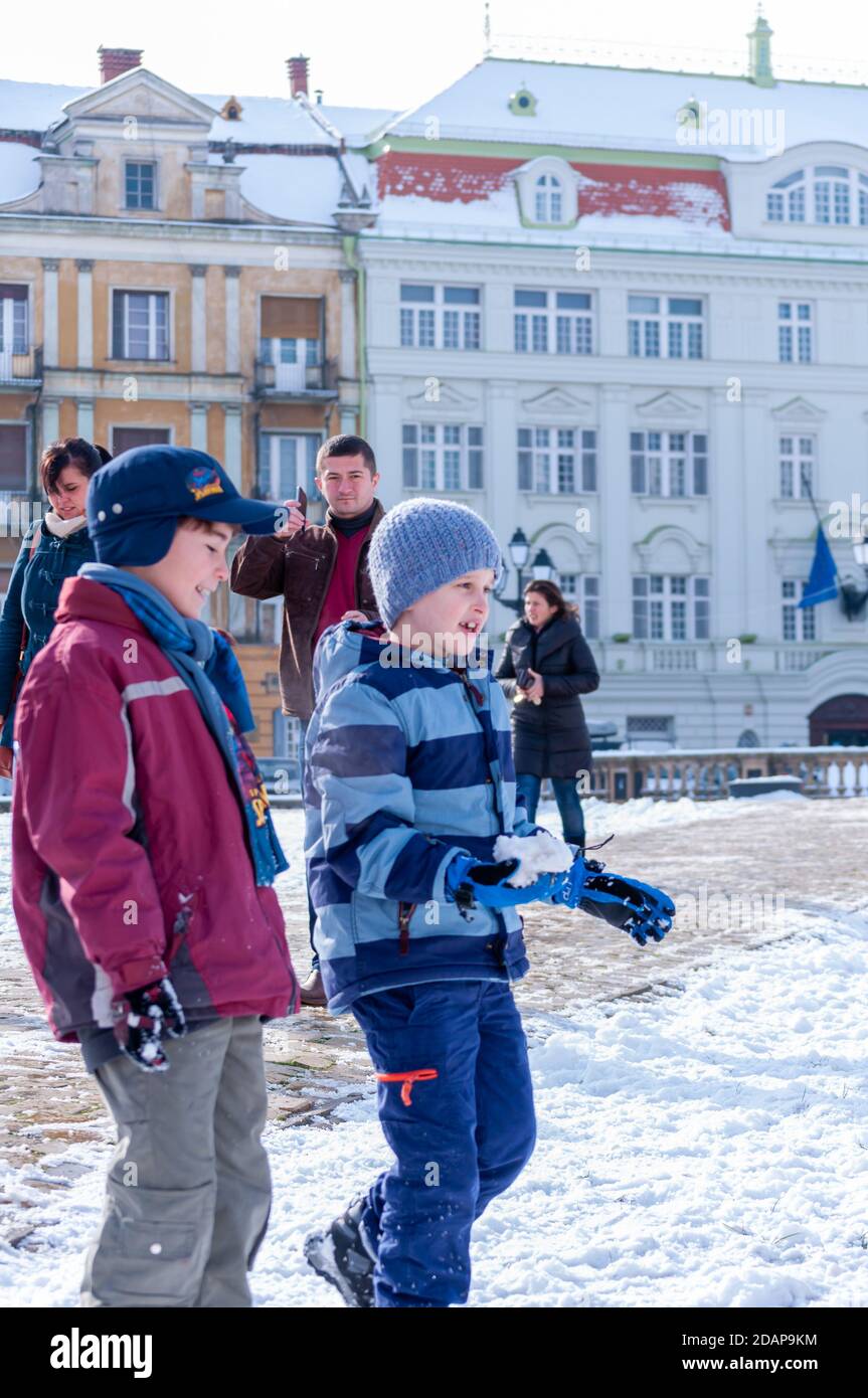 Timisoara, Romania - January 30, 2014: Kids playing with snow in the ...