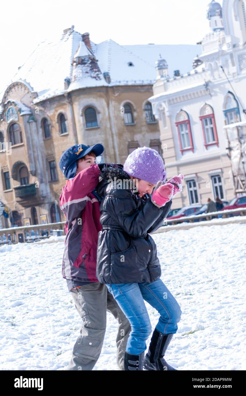 Timisoara, Romania - January 30, 2014: Kids playing with snow in the ...