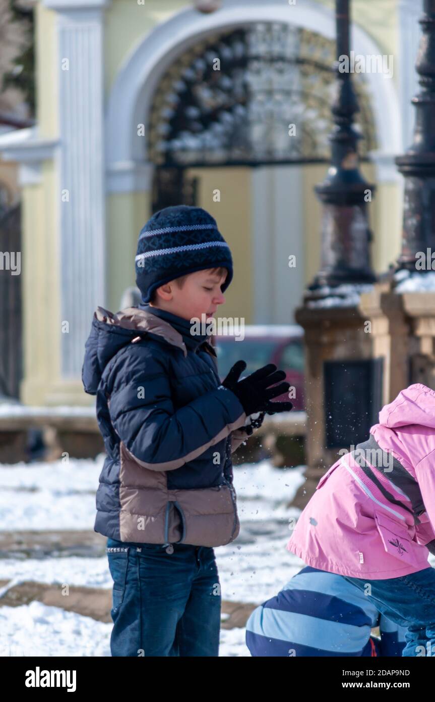 Timisoara, Romania - January 30, 2014: Kids playing with snow in the ...