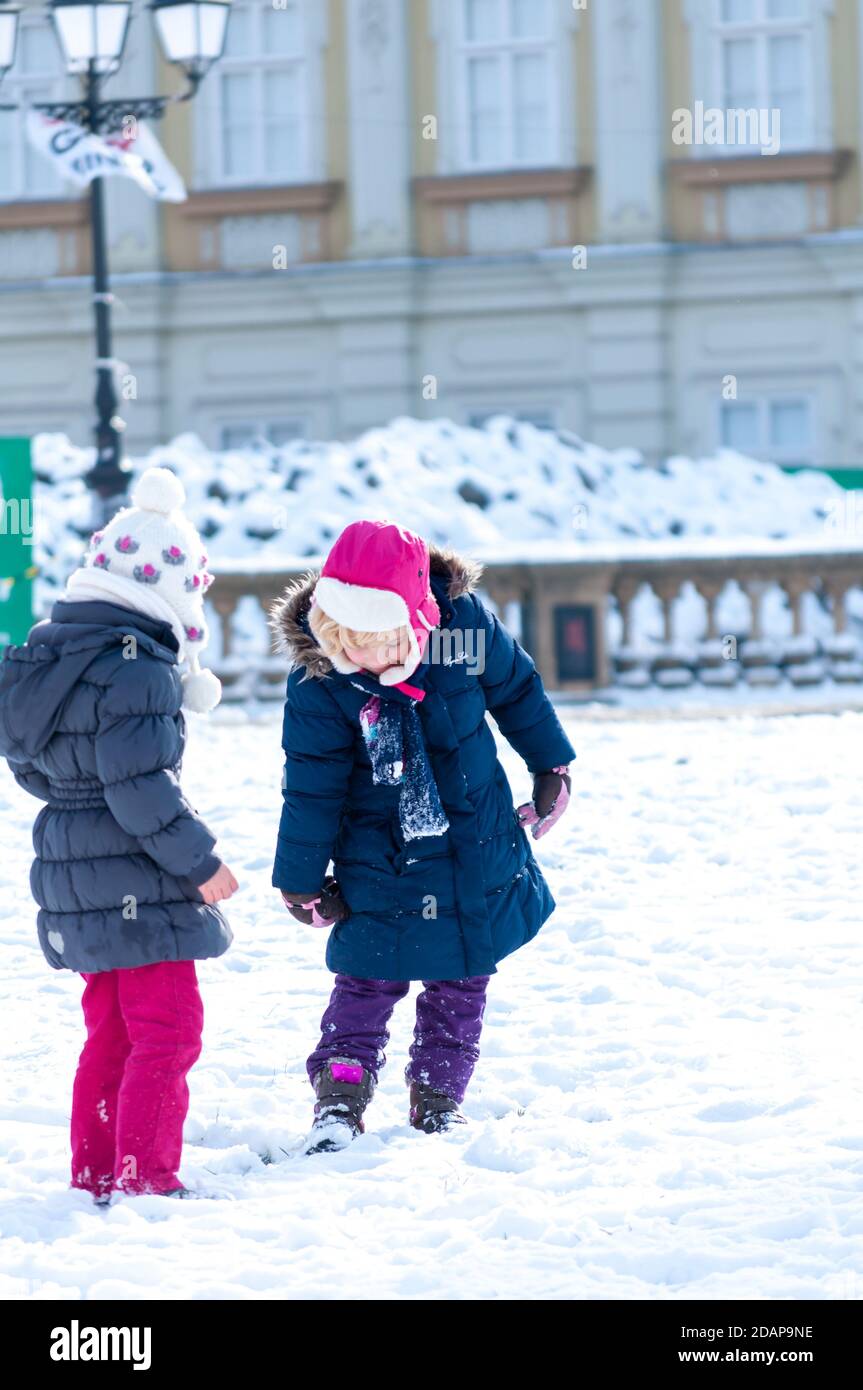 Timisoara, Romania - January 30, 2014: Kids playing with snow in the ...