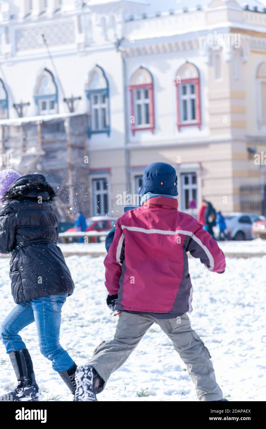 Timisoara, Romania - January 30, 2014: Kids playing with snow in the ...