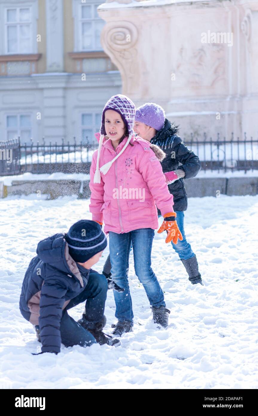 Timisoara, Romania - January 30, 2014: Kids playing with snow in the ...