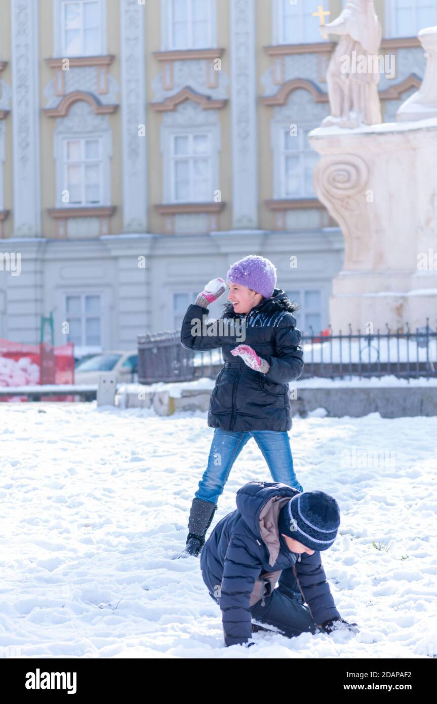 Timisoara, Romania - January 30, 2014: Kids playing with snow in the ...